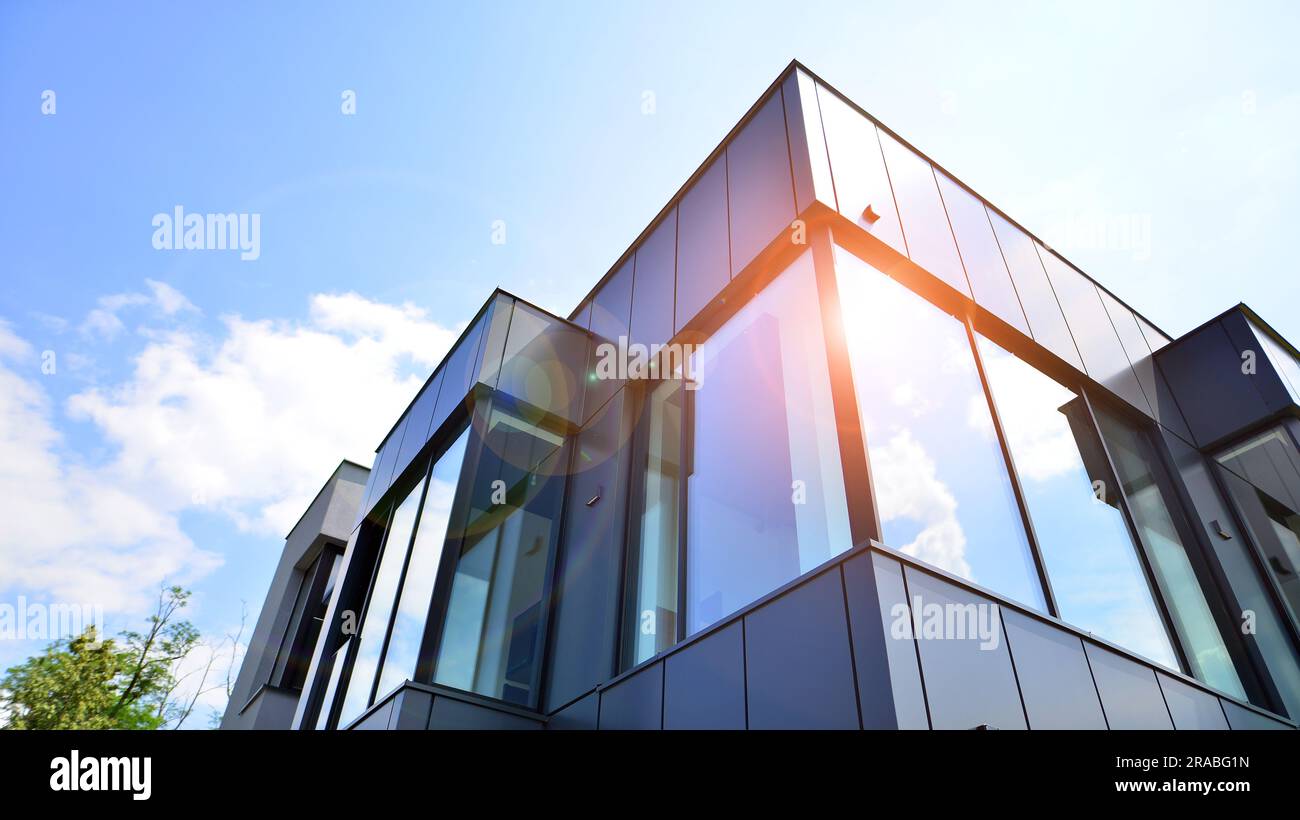 Graphite facade and large windows on a fragment of an office building ...