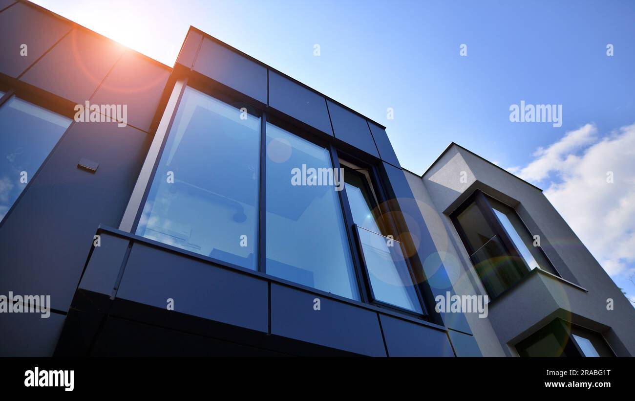 Graphite facade and large windows on a fragment of an office building ...