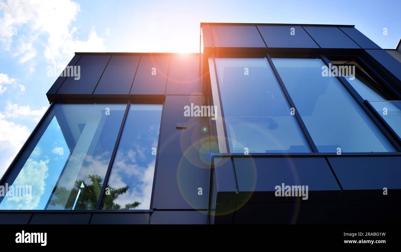 Graphite facade and large windows on a fragment of an office building ...
