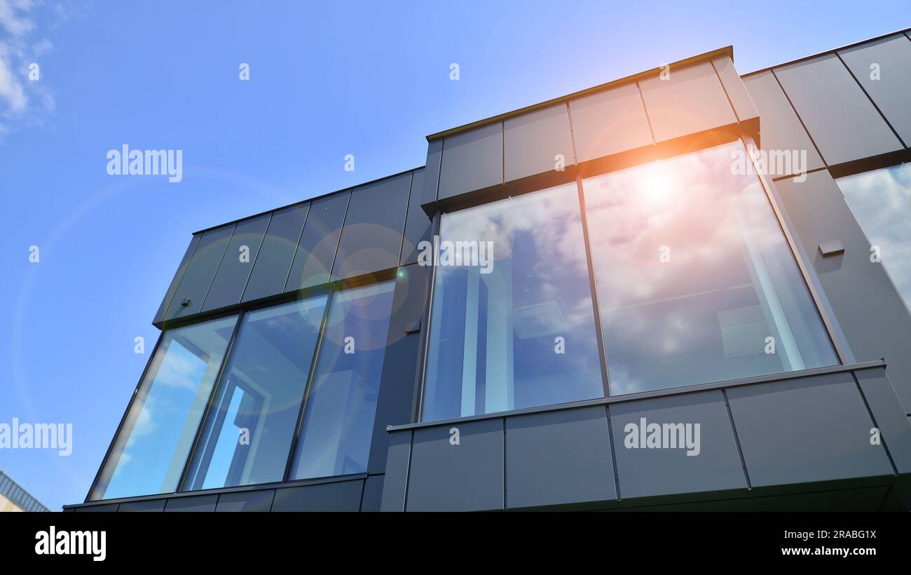Graphite facade and large windows on a fragment of an office building ...