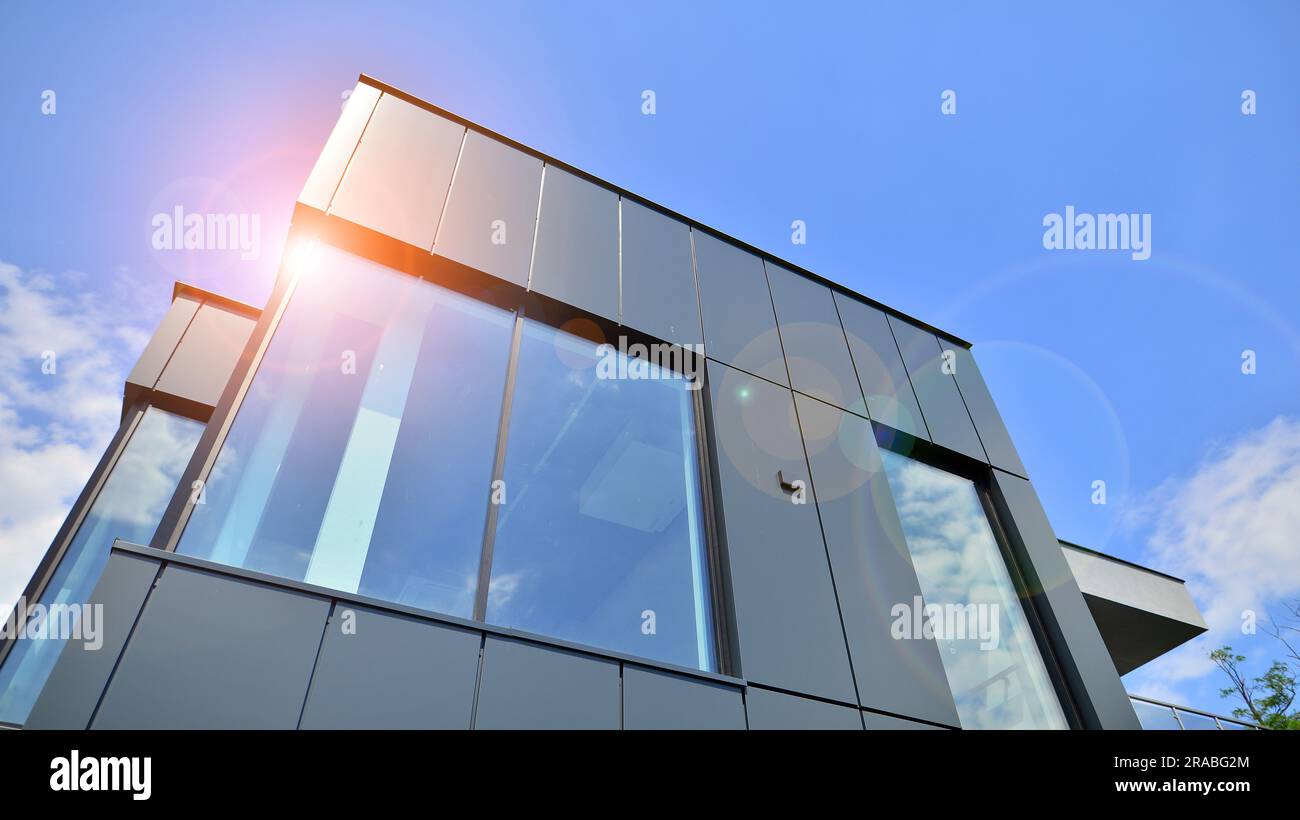 Graphite facade and large windows on a fragment of an office building ...