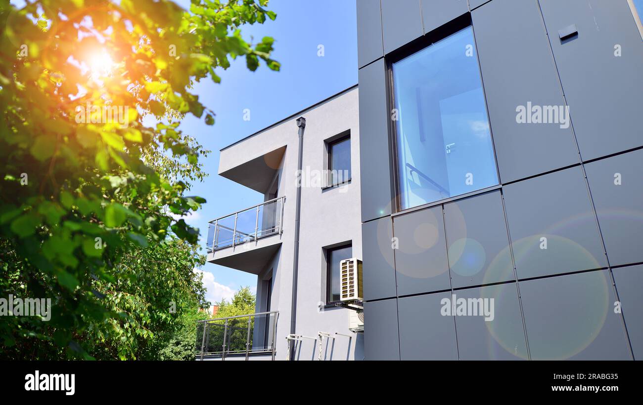 Graphite facade and large windows on a fragment of an office building ...