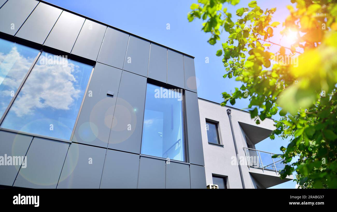 Graphite facade and large windows on a fragment of an office building ...