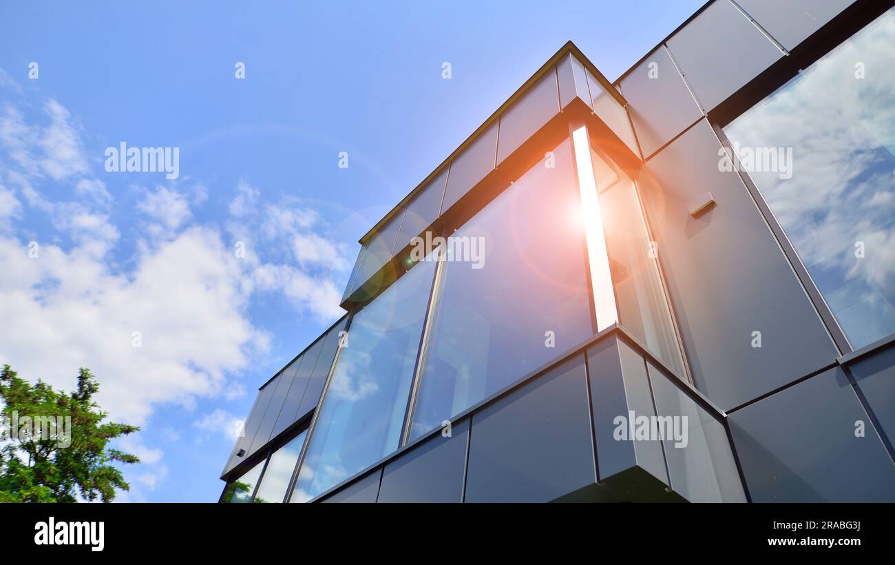 Graphite facade and large windows on a fragment of an office building ...