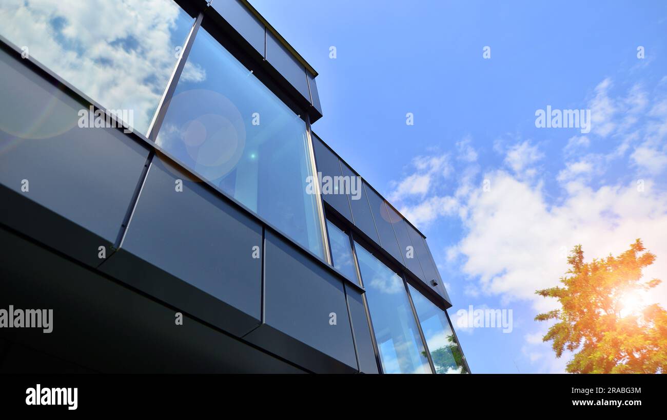 Graphite facade and large windows on a fragment of an office building ...