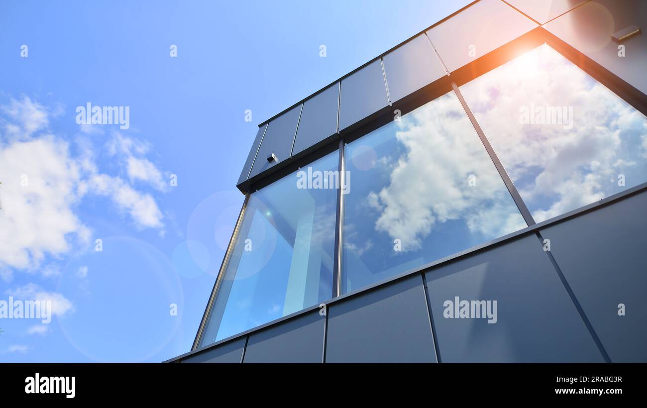 Graphite facade and large windows on a fragment of an office building ...