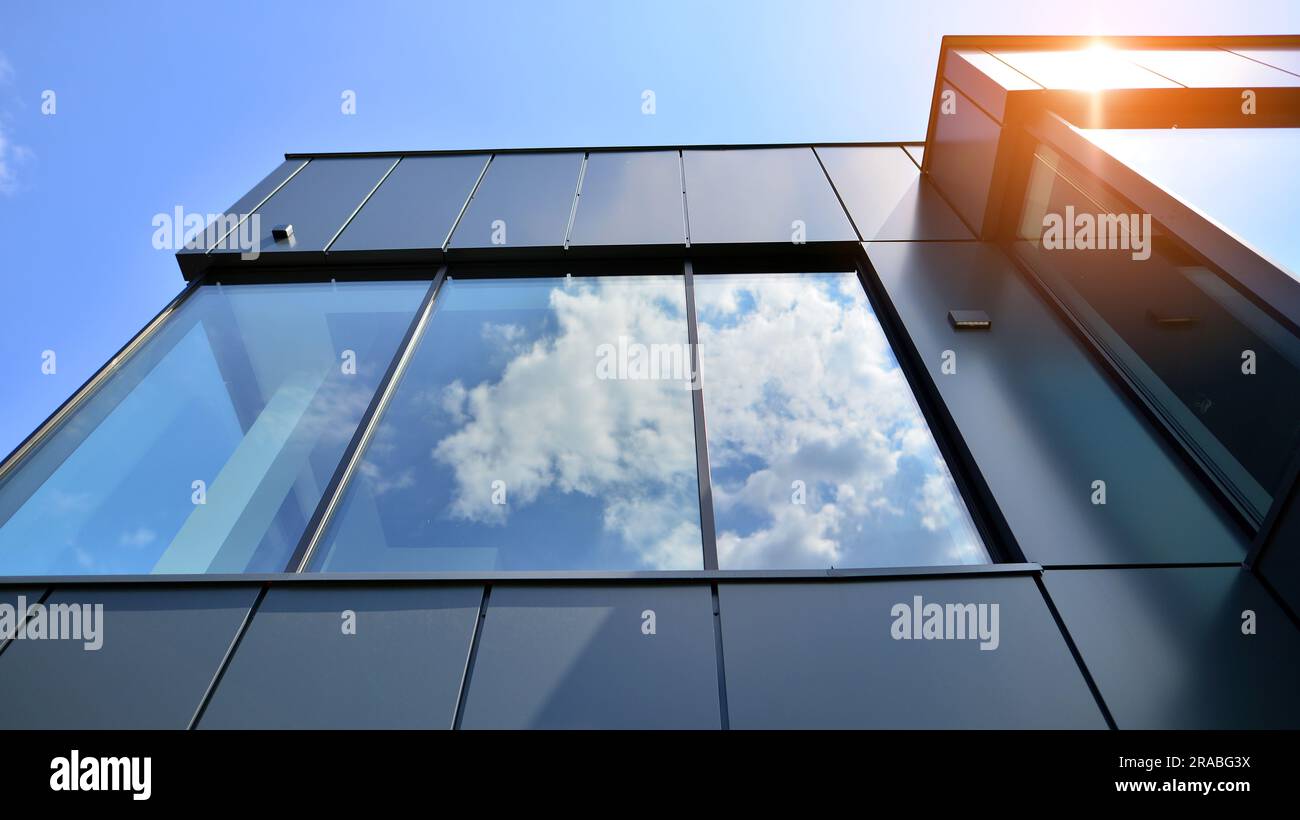 Graphite facade and large windows on a fragment of an office building ...