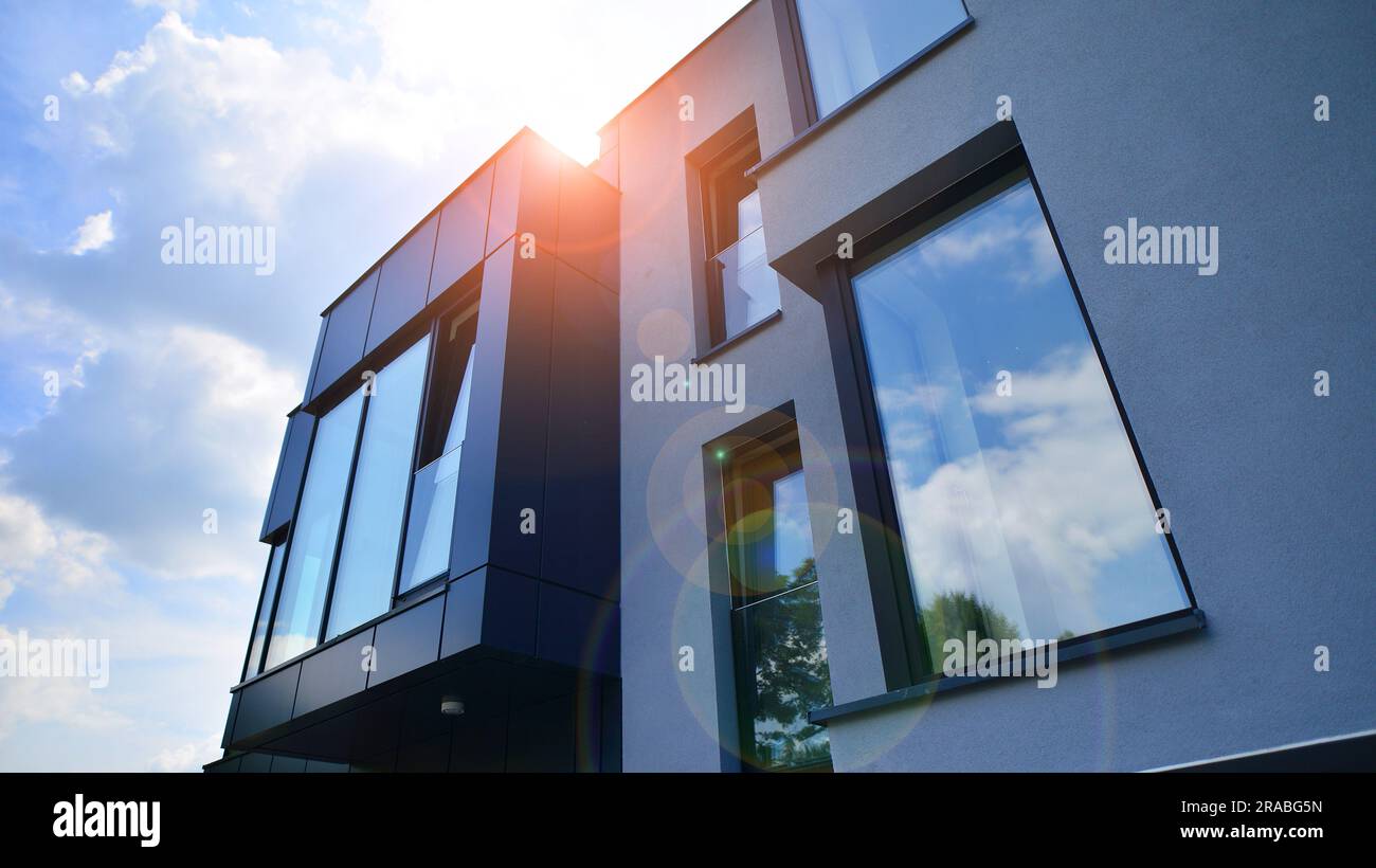 Graphite facade and large windows on a fragment of an office building ...