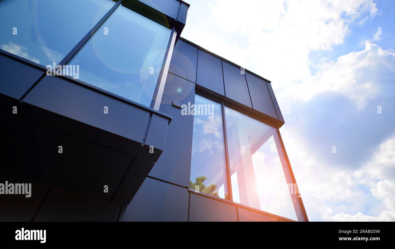 Graphite facade and large windows on a fragment of an office building ...
