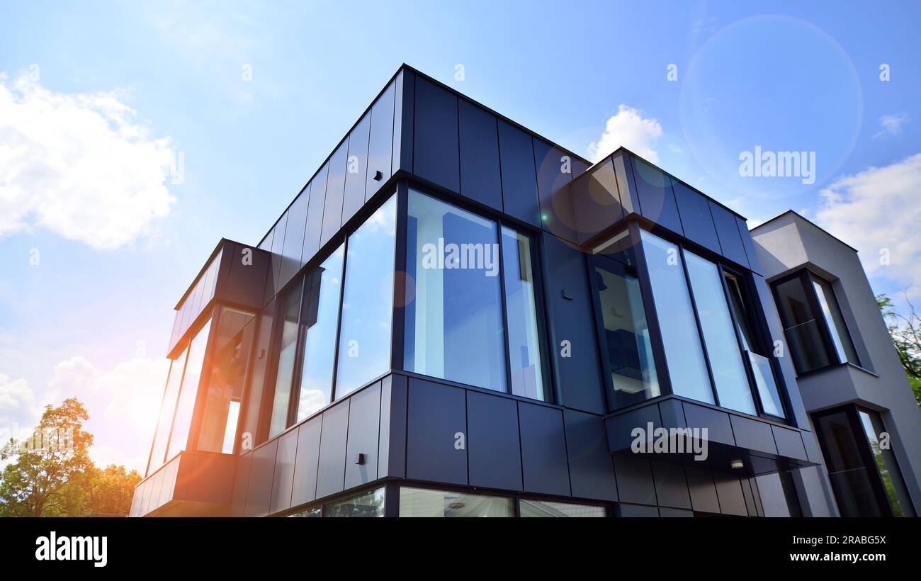 Graphite facade and large windows on a fragment of an office building ...