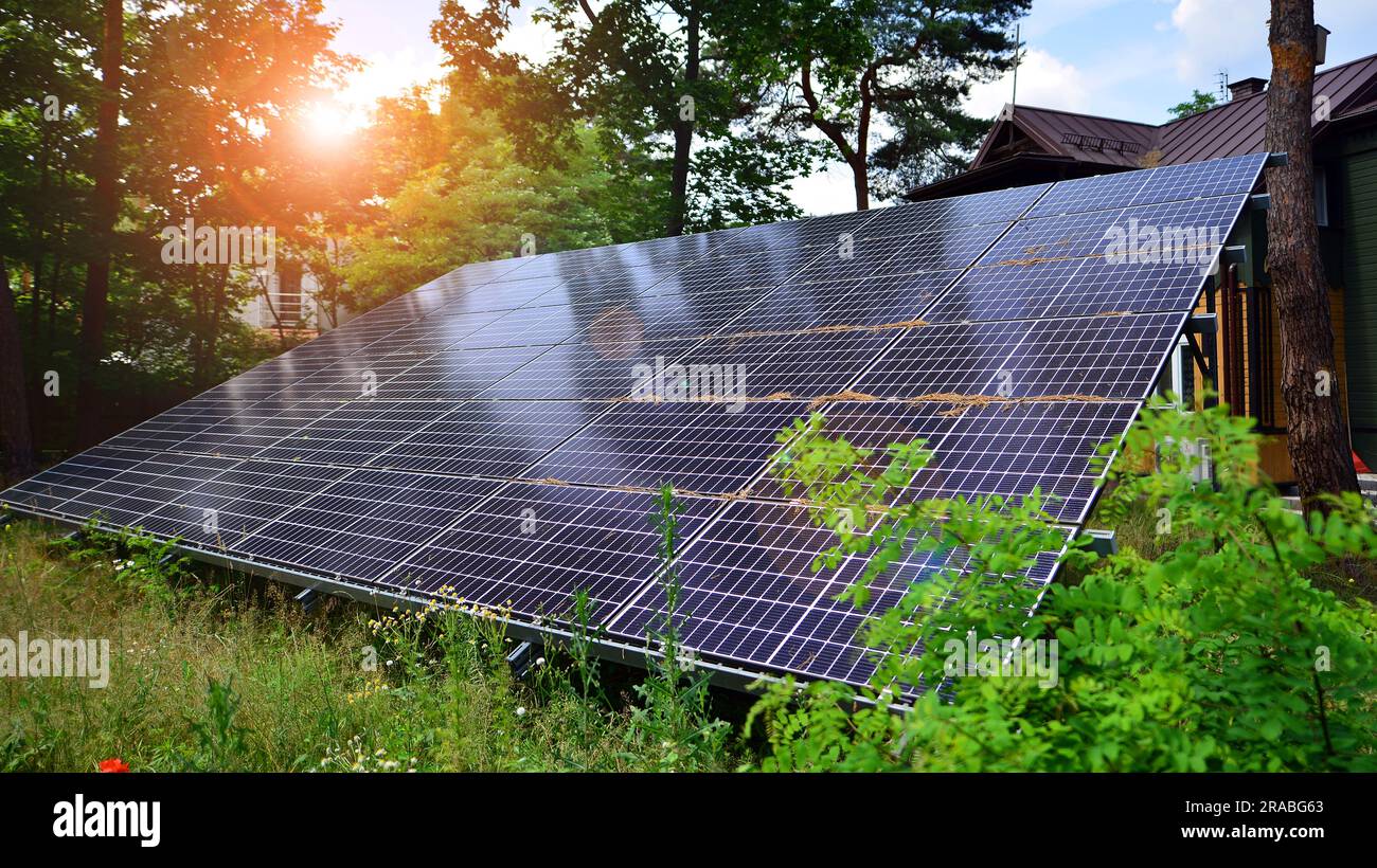 Photovoltaic panels standing on a paved surface against the background ...