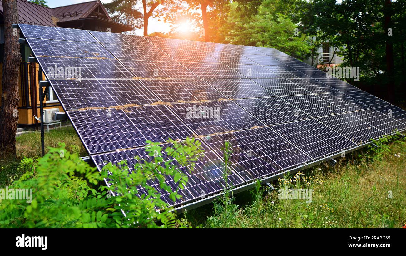 Photovoltaic panels standing on a paved surface against the background ...