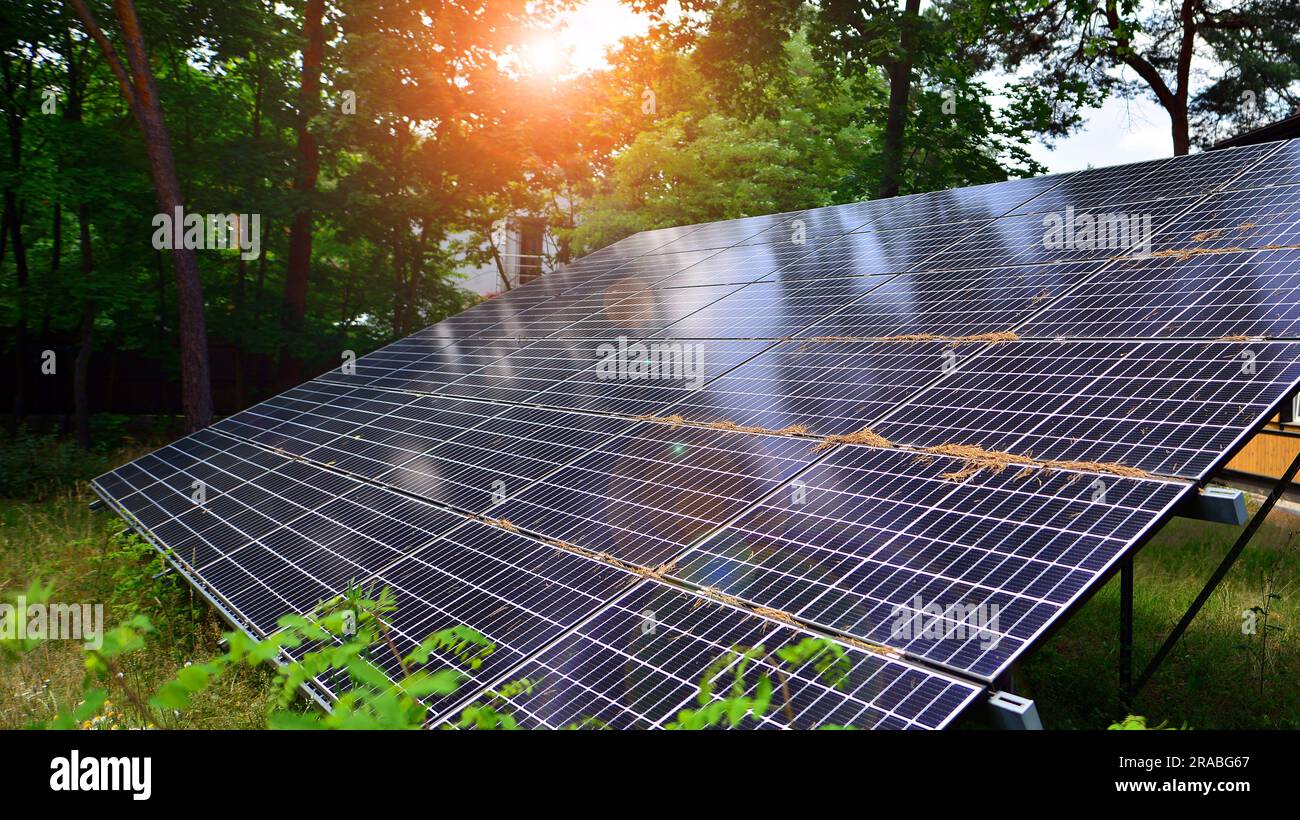 Photovoltaic panels standing on a paved surface against the background ...