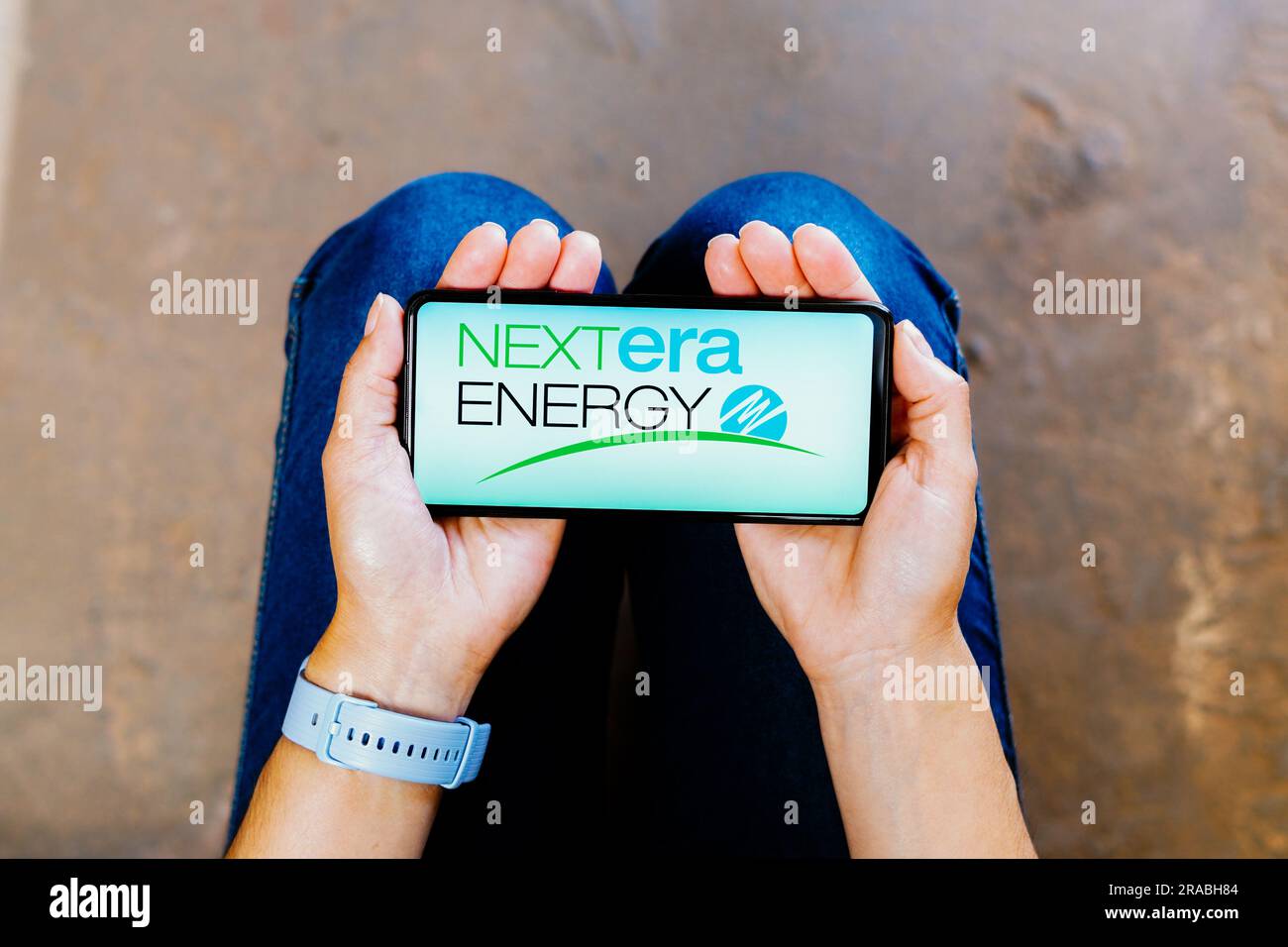 In this photo illustration, the NextEra Energy logo is displayed on a ...