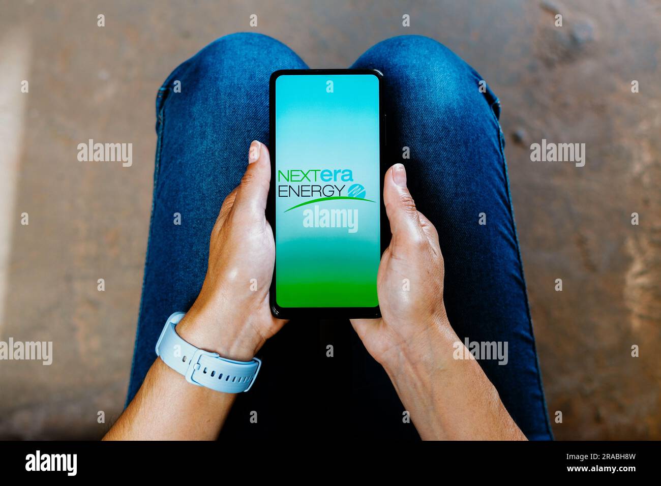 In this photo illustration, the NextEra Energy logo is displayed on a ...