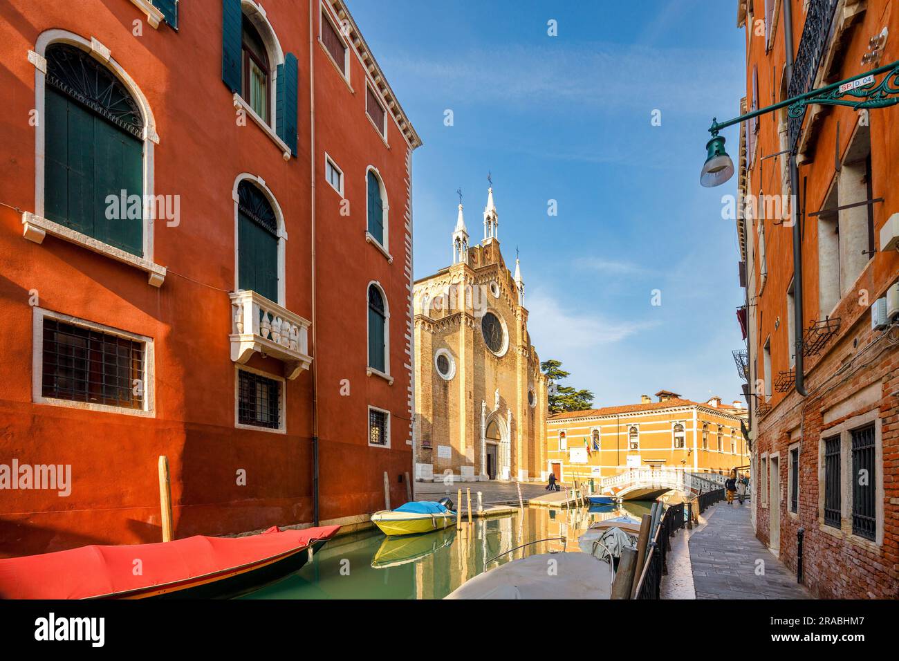 Canal with The Basilica di Santa Maria Gloriosa dei Frari, church in ...