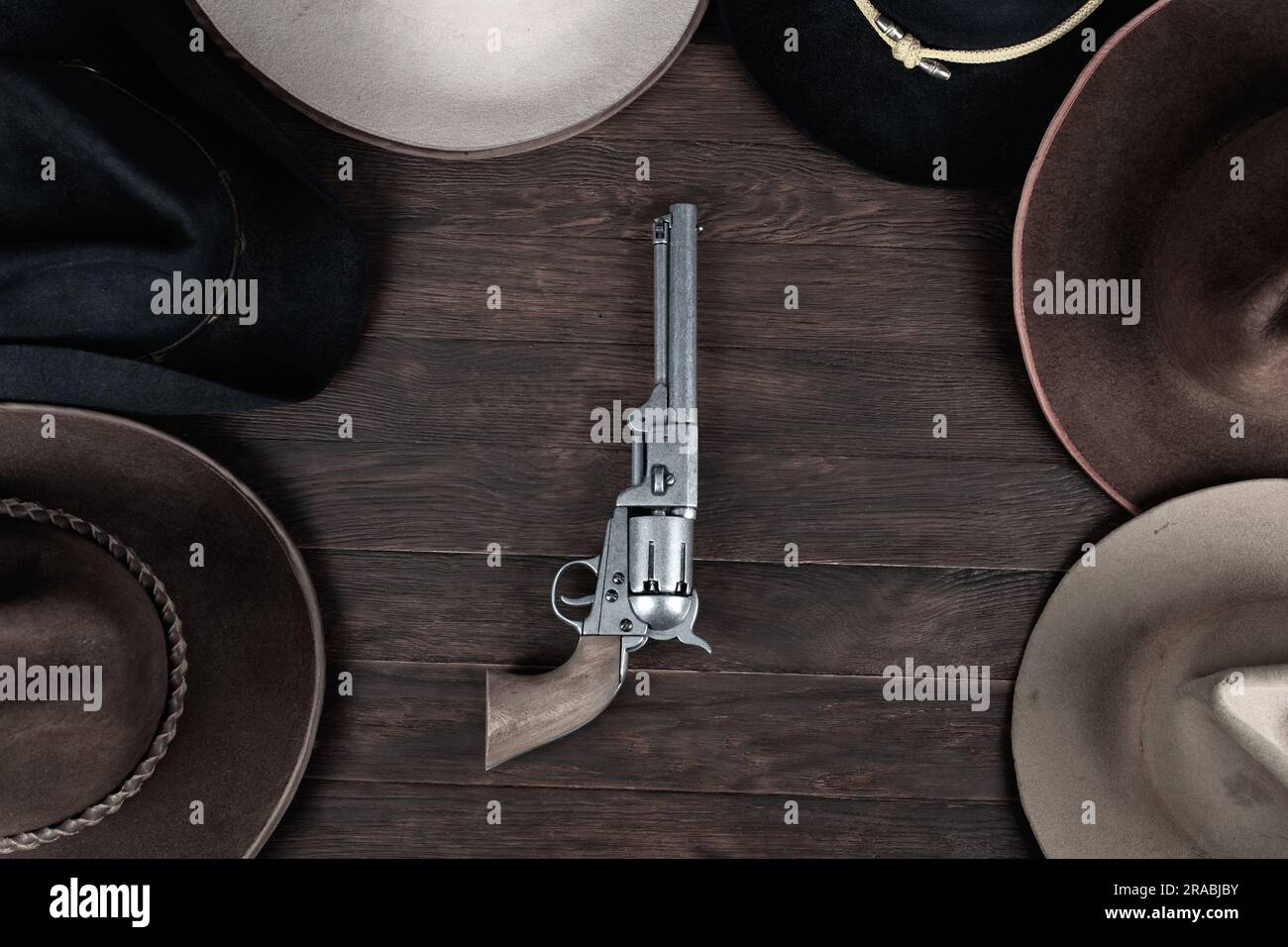Black gun on brown table hi-res stock photography and images - Alamy