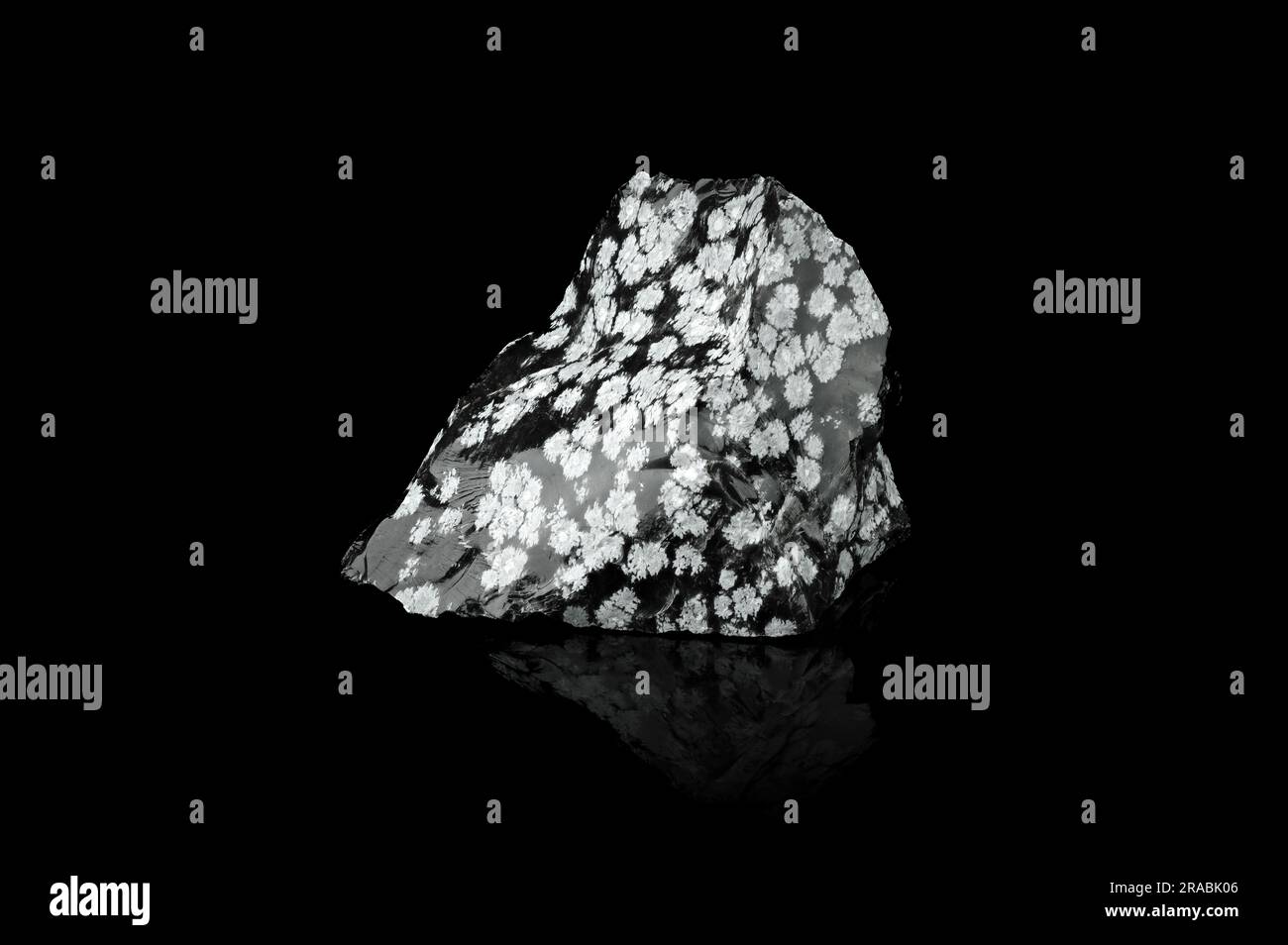 Snowflakes (cristobalite inclusion) on obsidian isolated on black ...