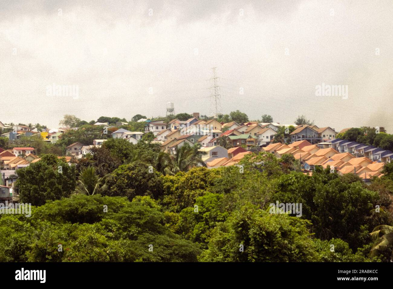 Houses atop a hill surrounded by trees in Bataan, Philippines Stock ...