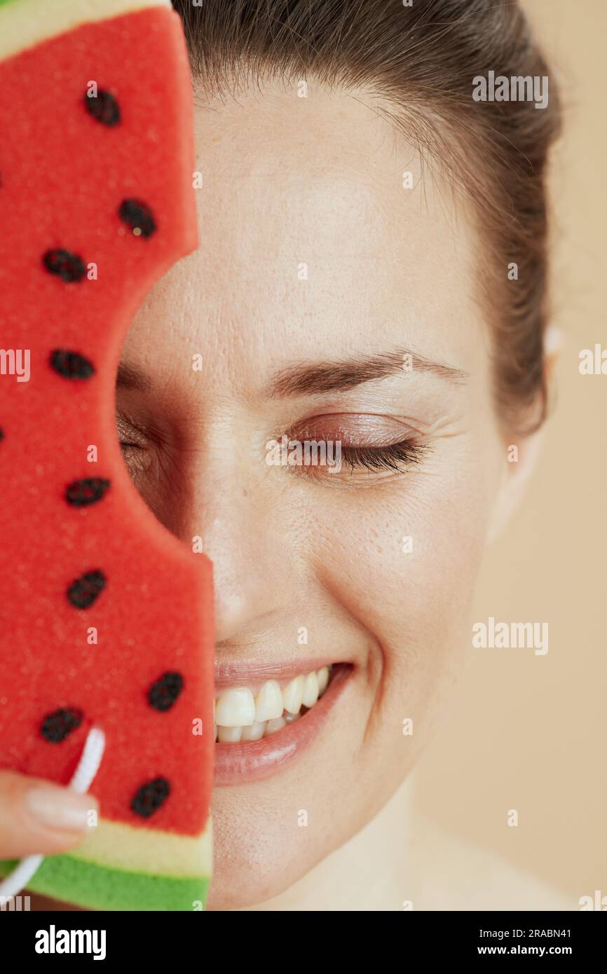 smiling modern middle aged woman with watermelon shower sponge Stock ...