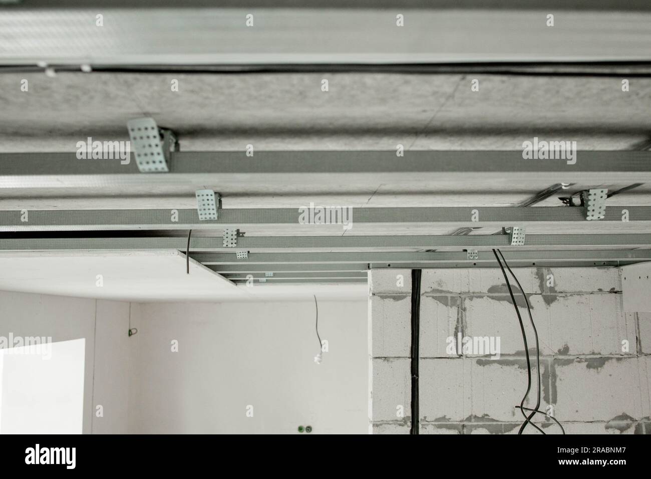 Suspended ceiling structure with profiles for installation of ceiling ...