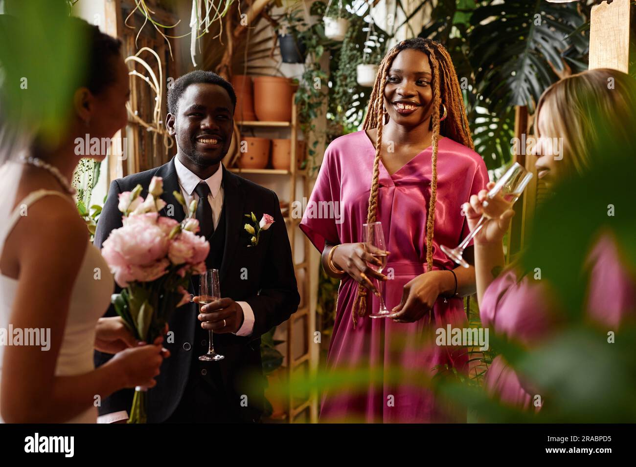 Group of black young people celebrating during wedding reception party ...
