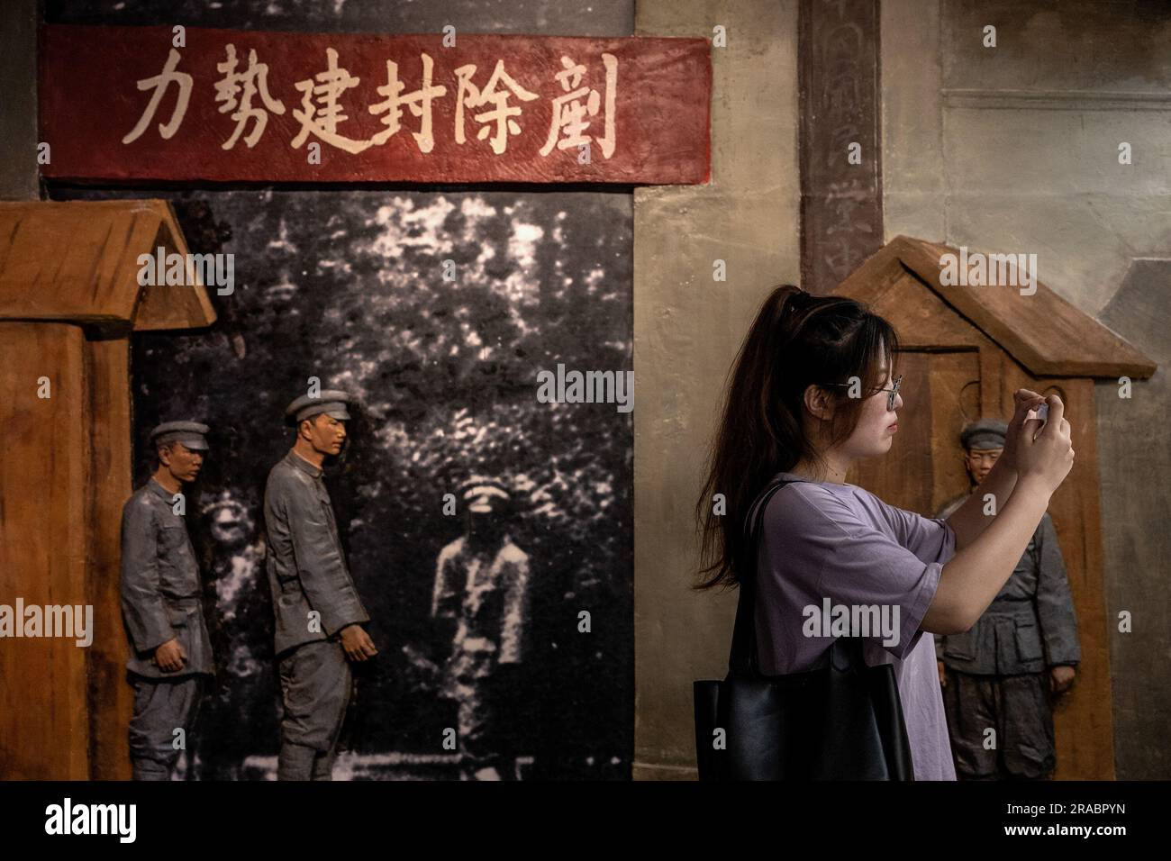 Wuhan, China. 01st July, 2023. A citizen takes photos with a phone at ...