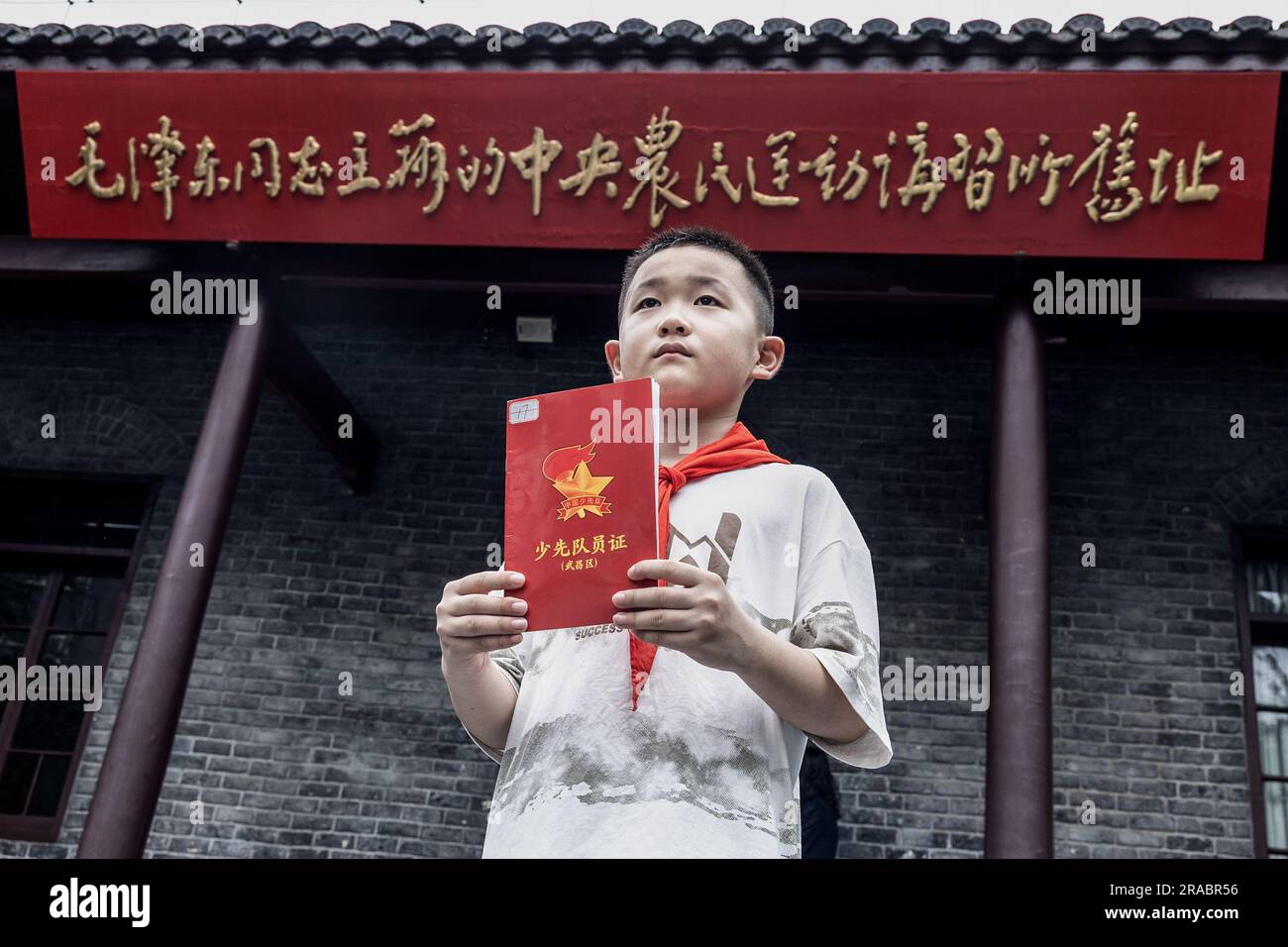 Wuhan, China. 01st July, 2023. A pupil of China Young Pioneers poses ...