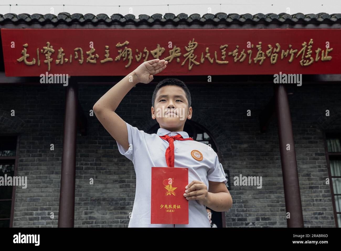 Wuhan, China. 01st July, 2023. A pupil of China Young Pioneers poses ...