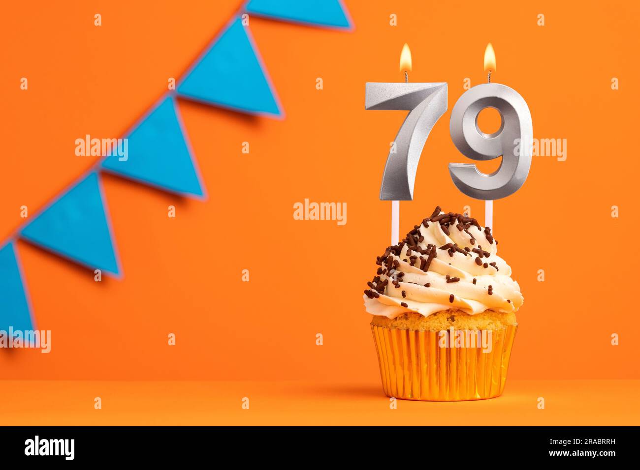 Candle number 79 - Cake birthday in orange background Stock Photo - Alamy
