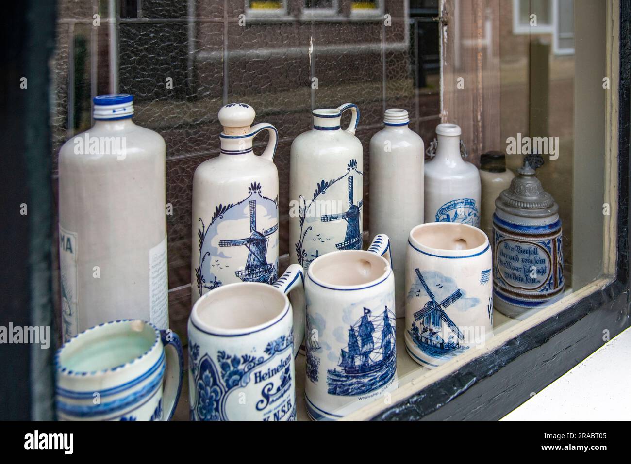 antique store window showing Delft Blue pottery for sale Stock Photo ...