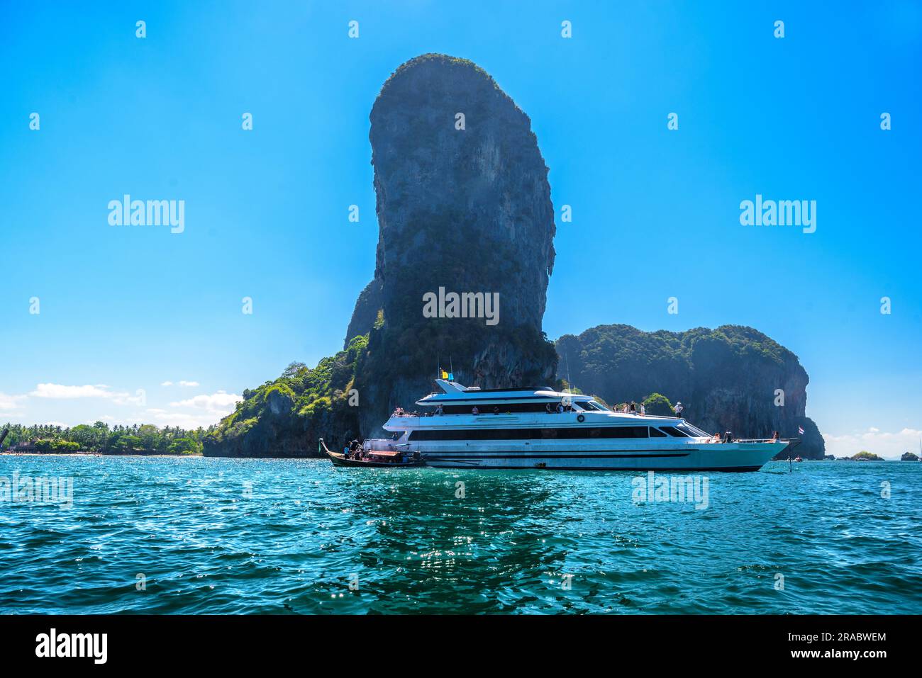 Motor ship with cliff rock in azure water, Ko Rang Nok, Ao Phra Nang ...