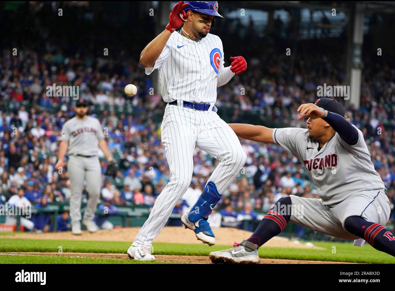 Chicago Cubs' Christopher Morel, front left, is safe at first base with ...