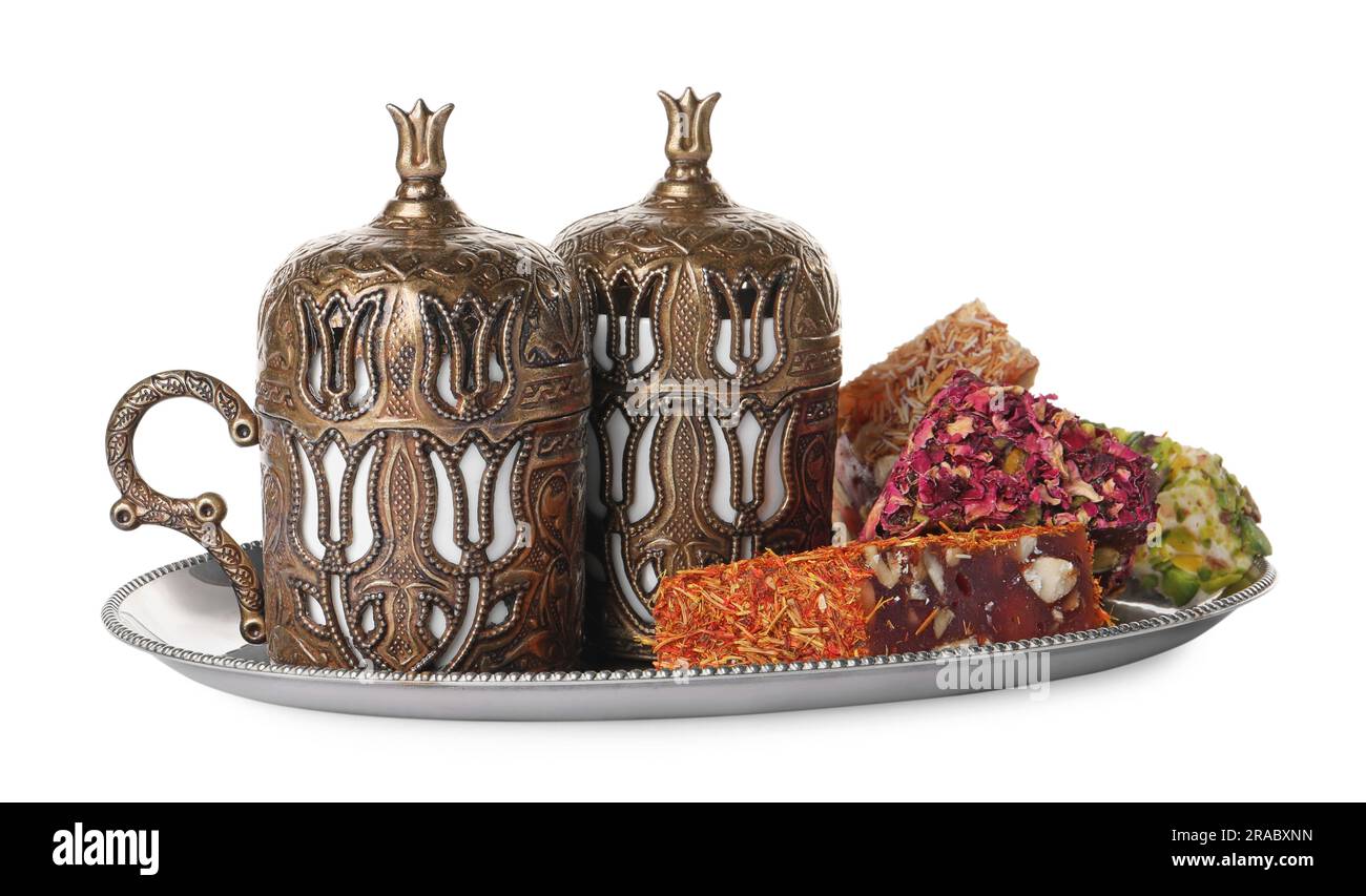 Tea and Turkish delight served in vintage tea set on white background ...