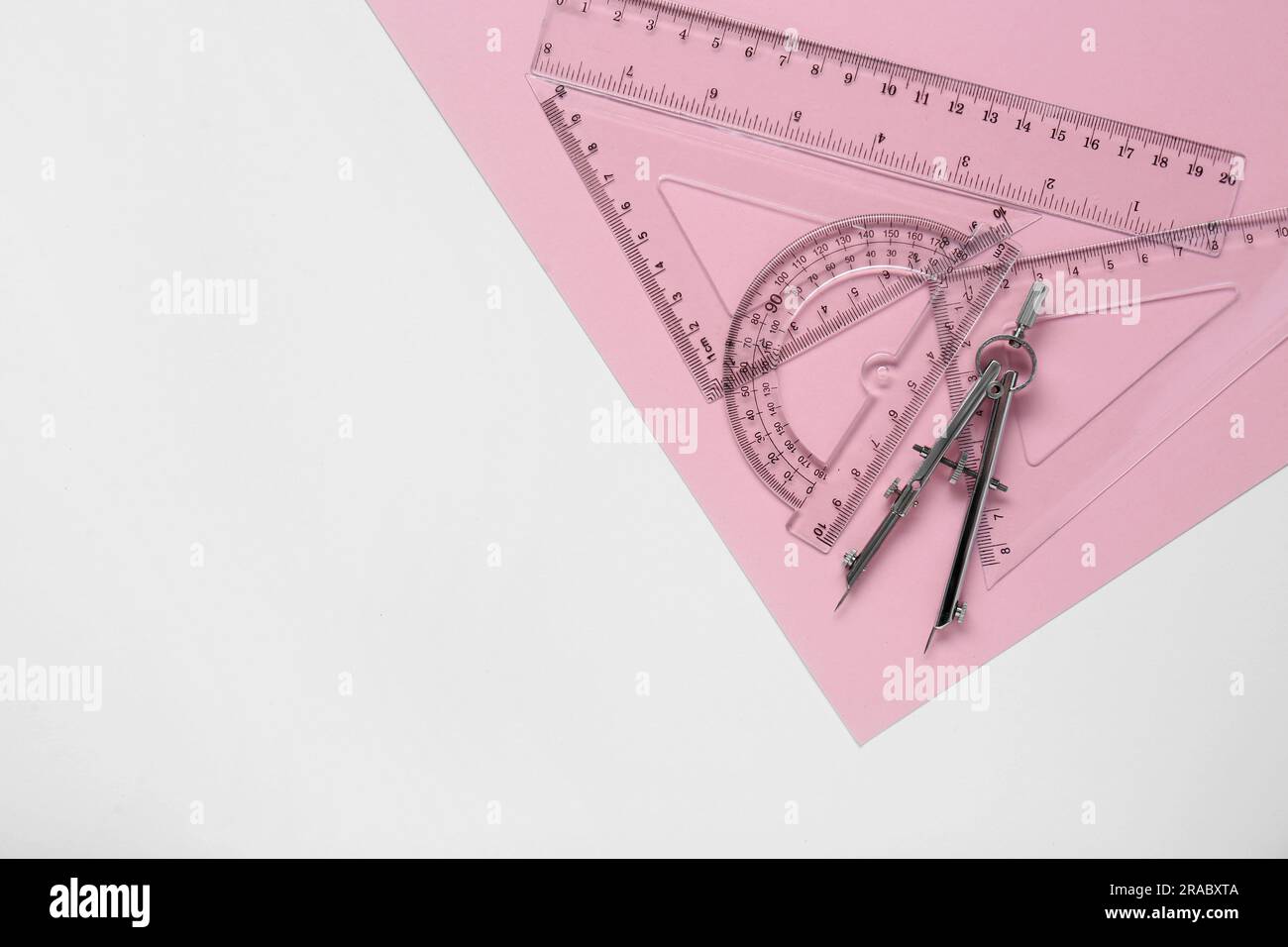 Different rulers and compass on color background. Space for text Stock ...