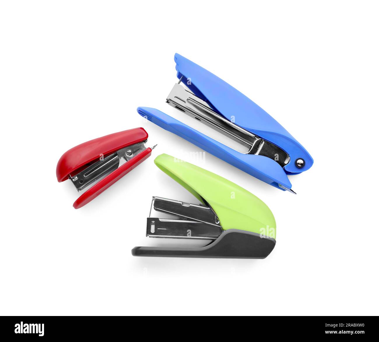 Bright color staplers isolated on white, top view Stock Photo - Alamy