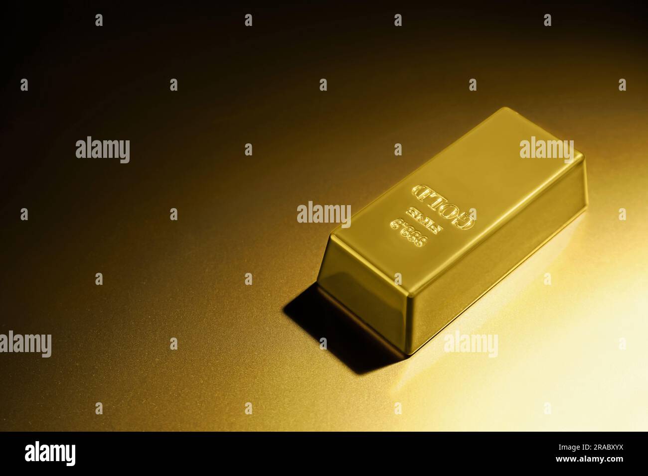 Shiny gold bar on color background, space for text Stock Photo - Alamy