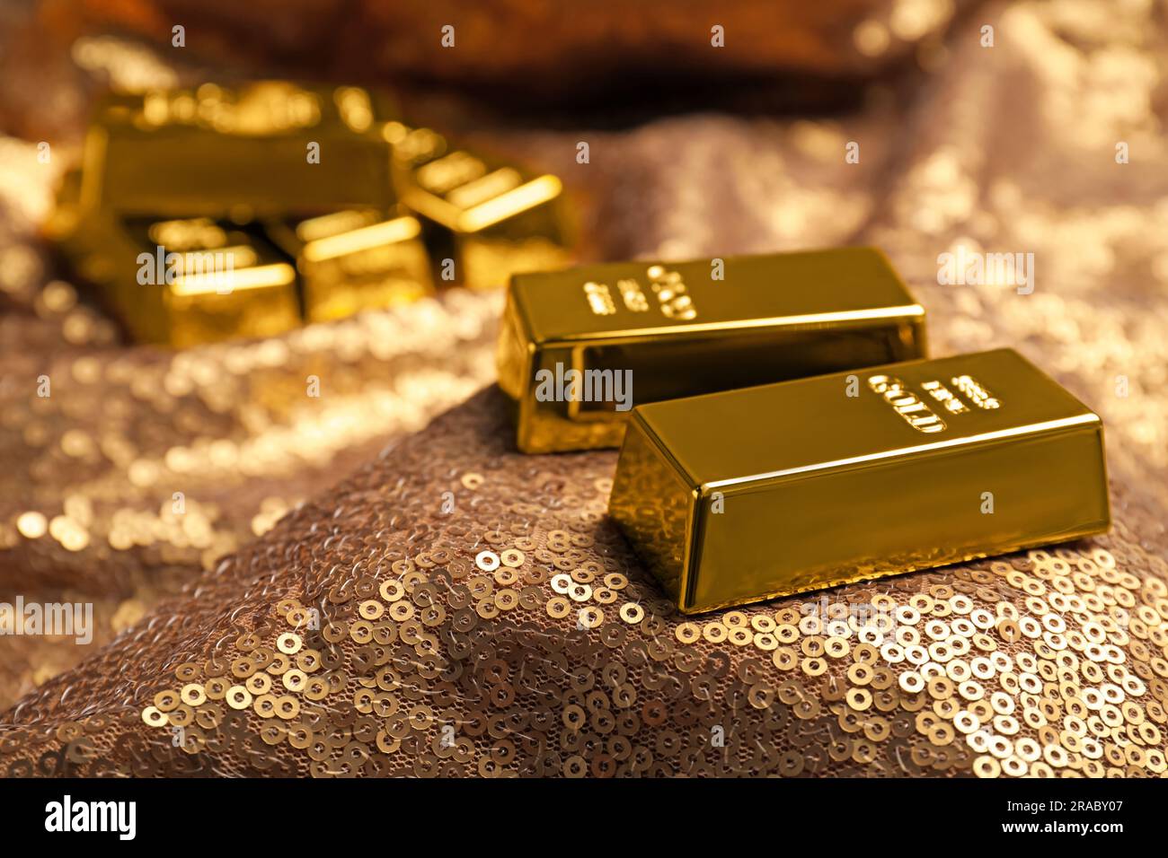 Shiny gold bars on bronze sequin fabric, closeup. Space for text Stock Photo - Alamy