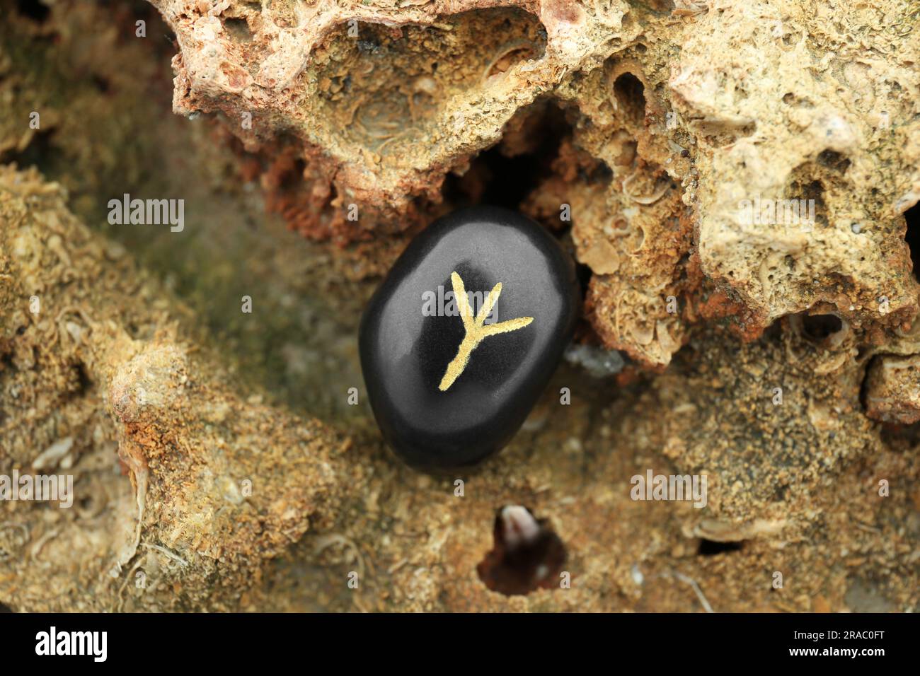 Black rune Algiz on stone outdoors, closeup Stock Photo - Alamy