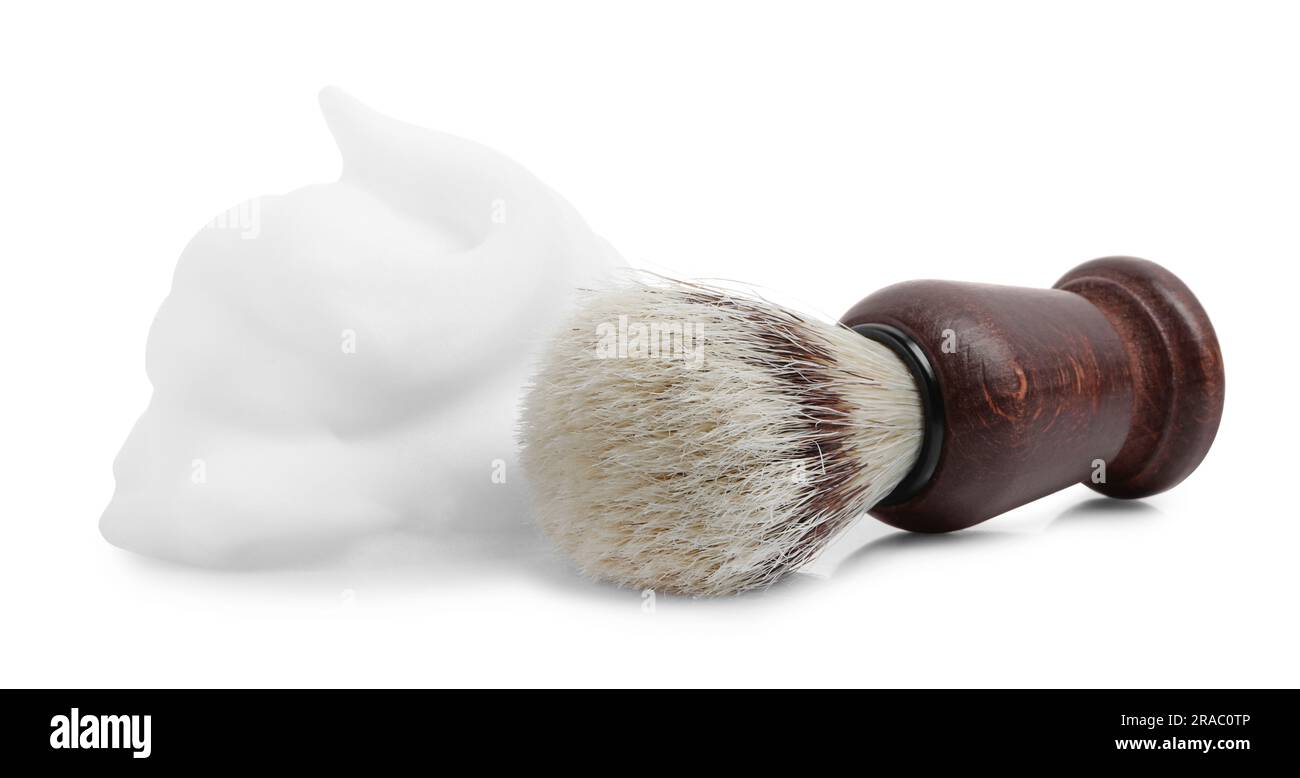 Shaving foam and brush on white background Stock Photo - Alamy