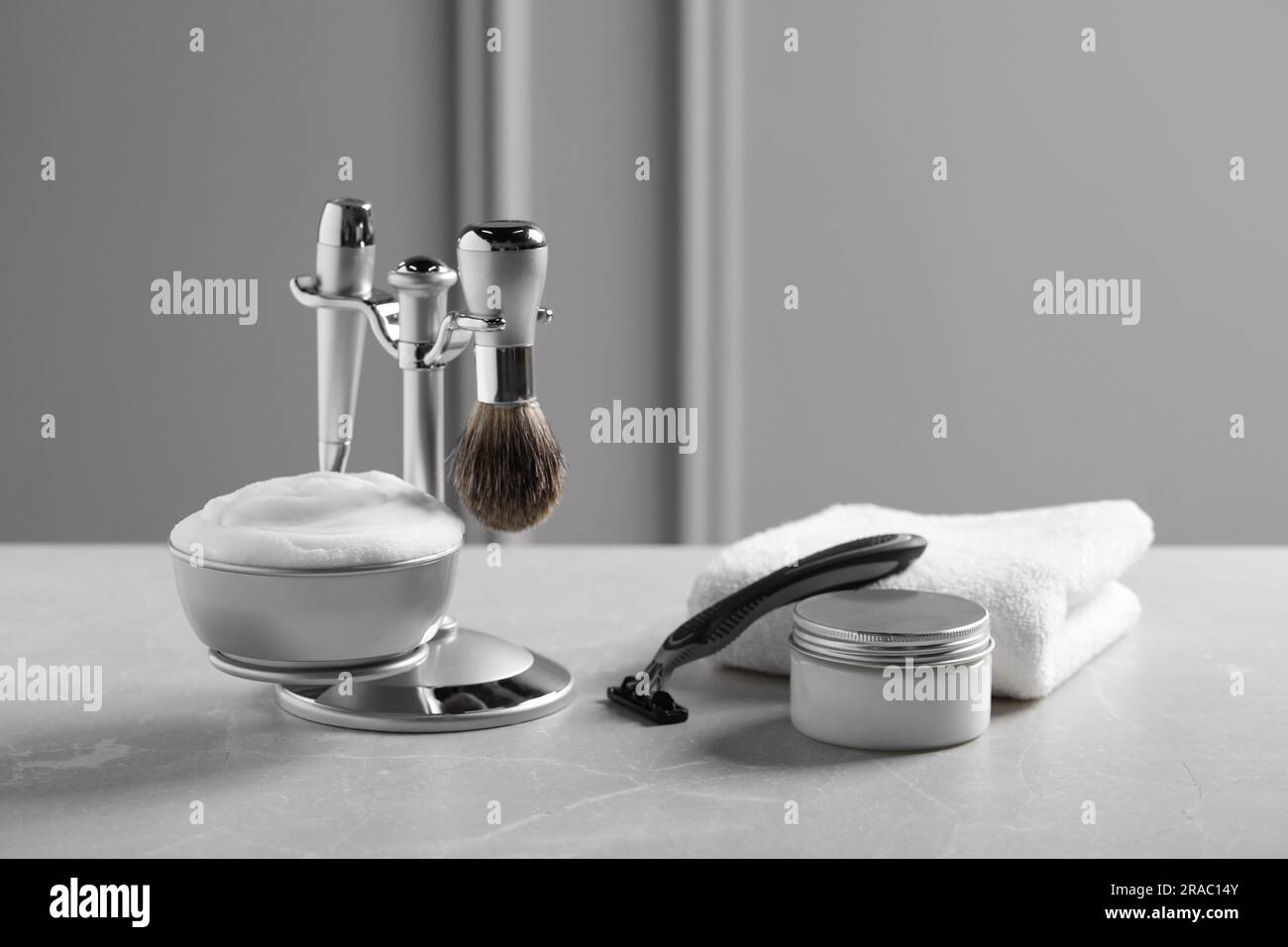 Set of men's shaving tools on grey table Stock Photo - Alamy