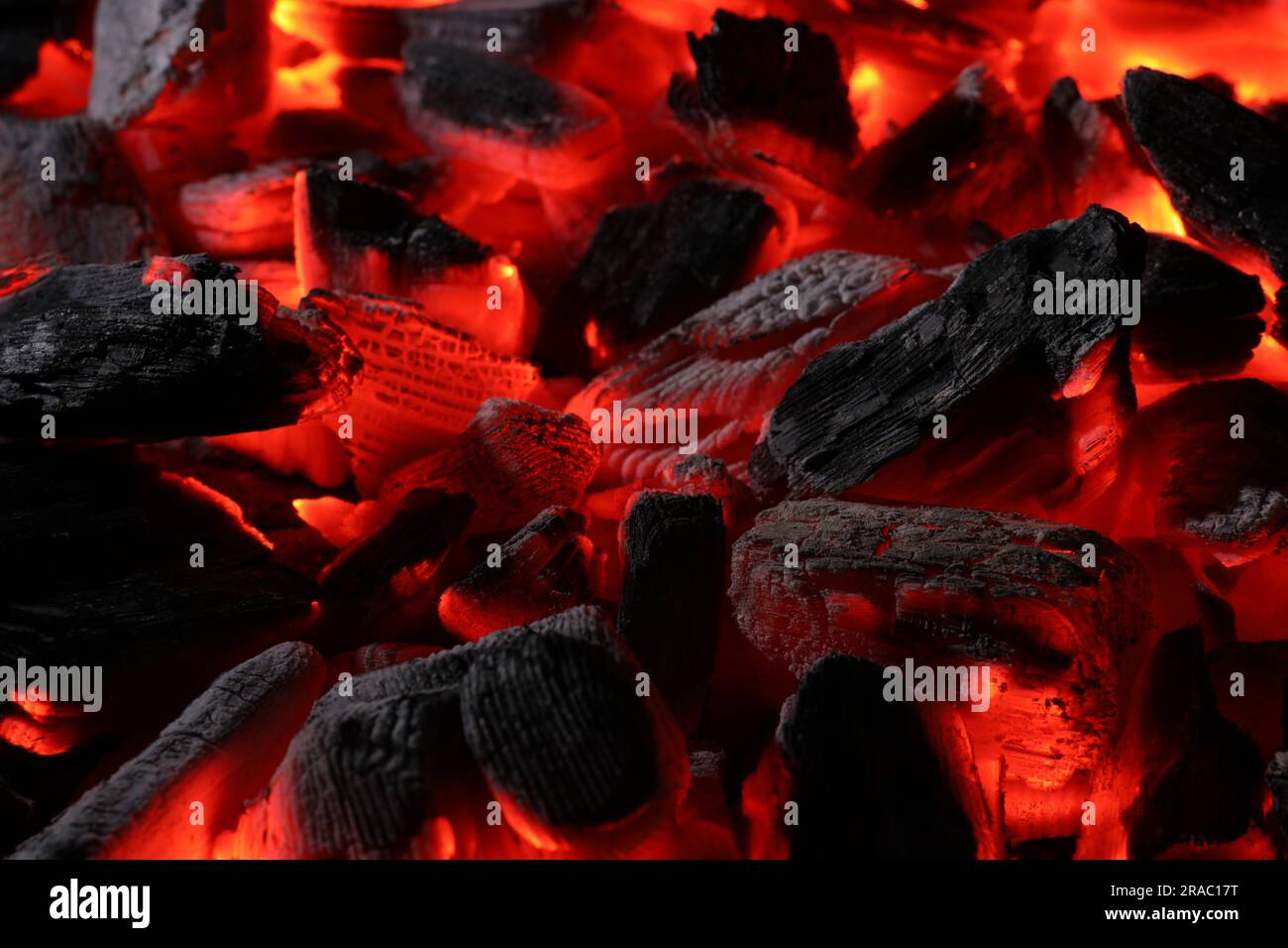 Pieces of hot smoldering coal as background, closeup Stock Photo - Alamy