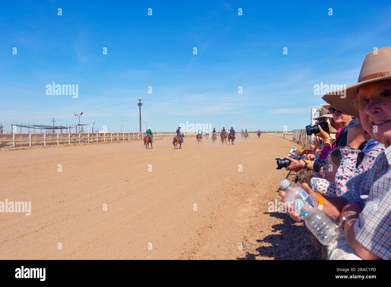 Spectators standing along the race track at the Brunette Downs ABC Bush ...