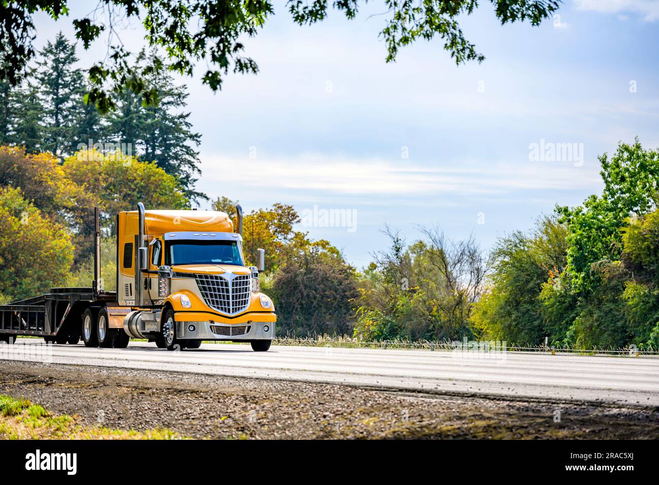 Industrial grade yellow bonnet big rig long hauler semi truck tractor ...