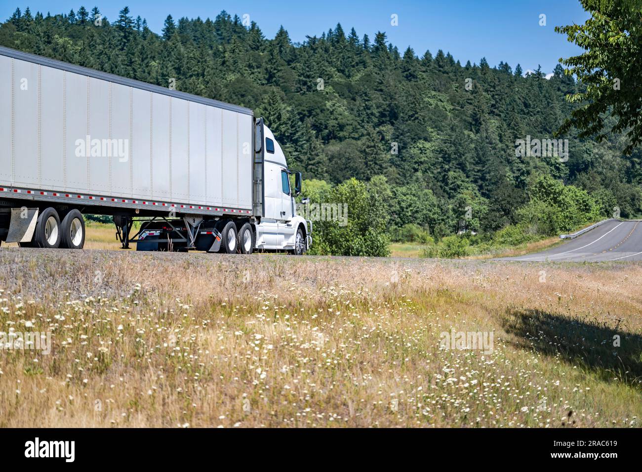 Commercial truck driving on scenic hi-res stock photography and images ...