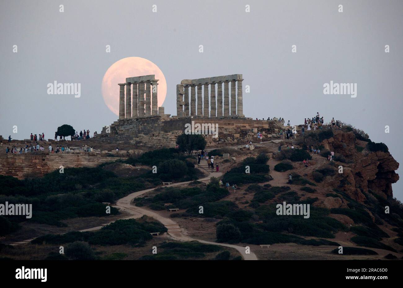 Sounio, Greece. 2nd July, 2023. The full moon rises above the Ancient ...