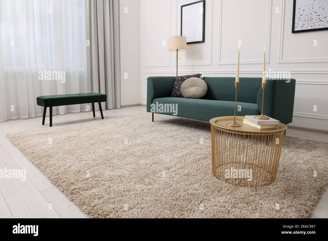 Stylish living room with soft beige carpet, coffee table and sofa ...