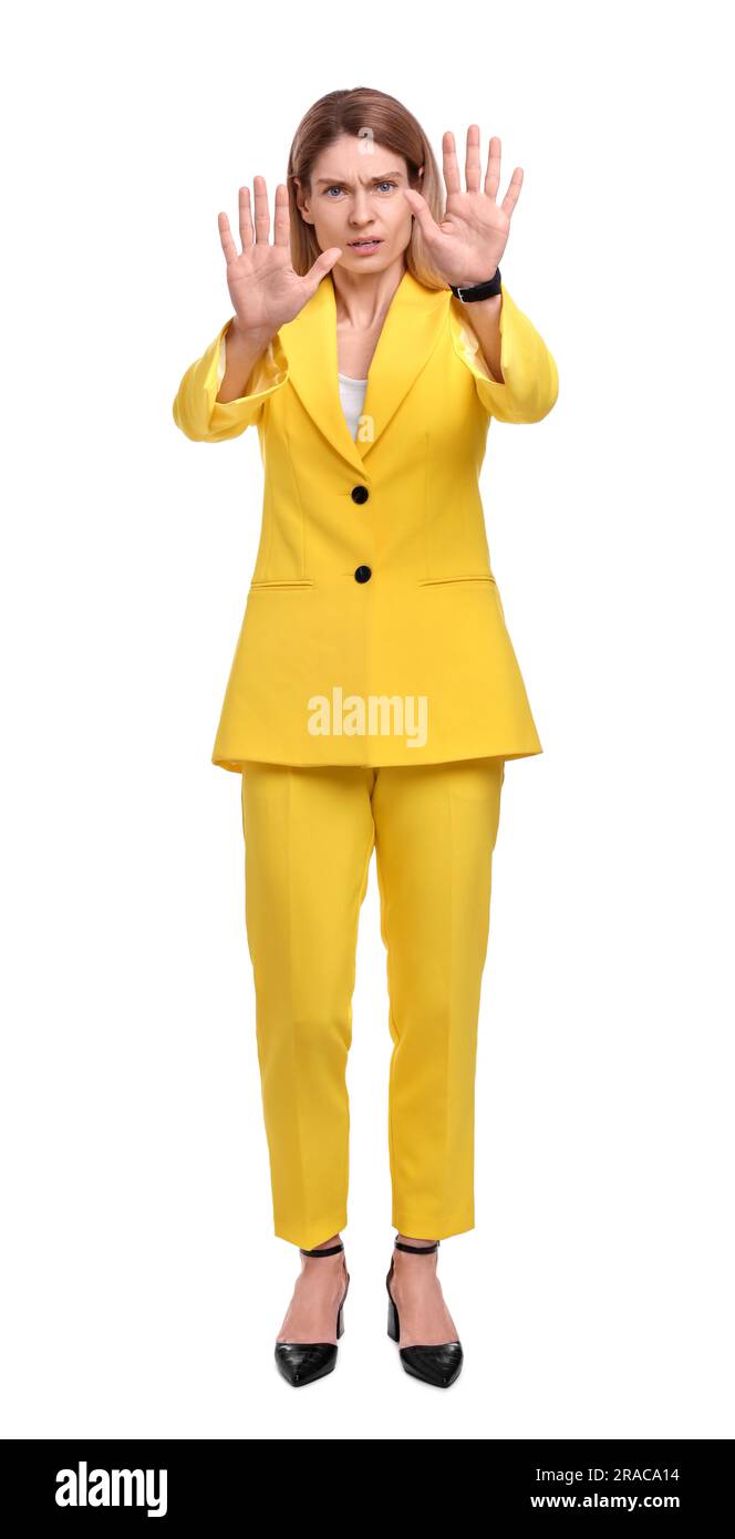 Beautiful emotional businesswoman avoiding something on white ...