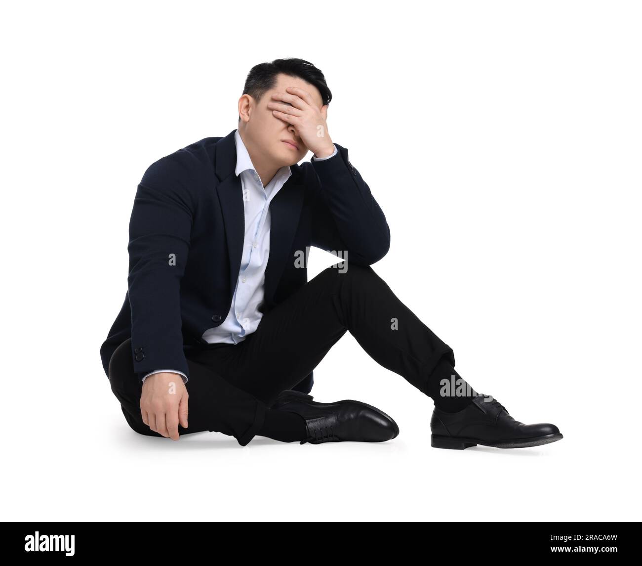 Person in formal suit sitting Cut Out Stock Images & Pictures - Alamy
