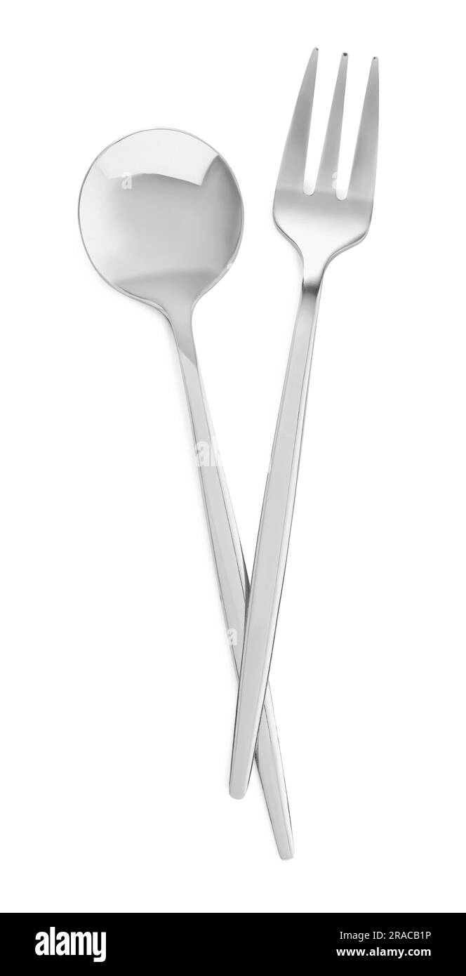 Spoon and fork isolated on white, top view. Stylish shiny cutlery set ...